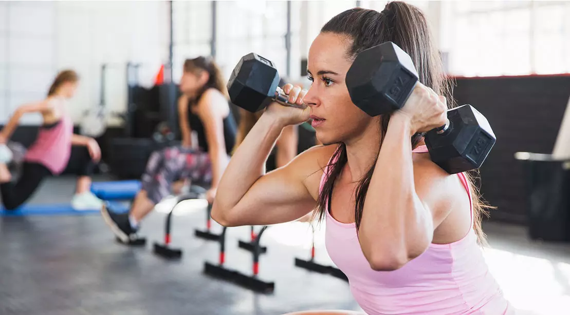 1109 Woman Dumbbell Overhead Squat GettyImages 922708878