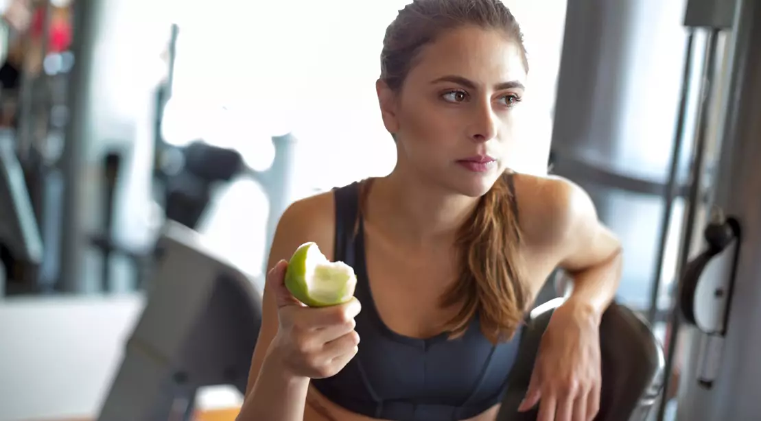 Fitness-Girl-Eating-Apple