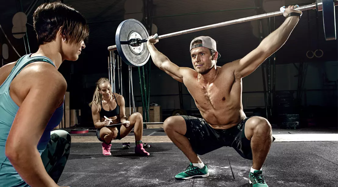 Ladies-Looking-At-Guy-Barbell-Snatch