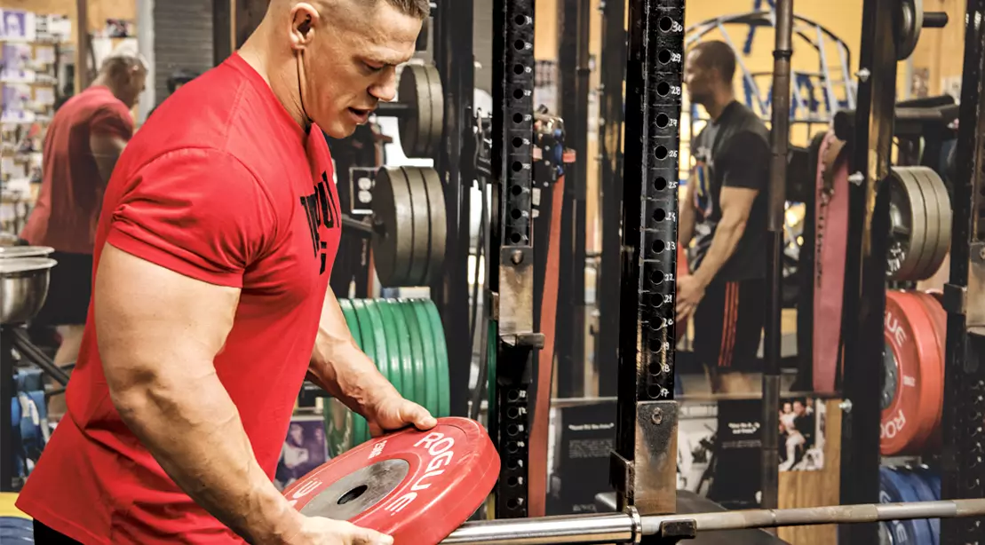 John-Cena-Placing-Weights-On-Bar