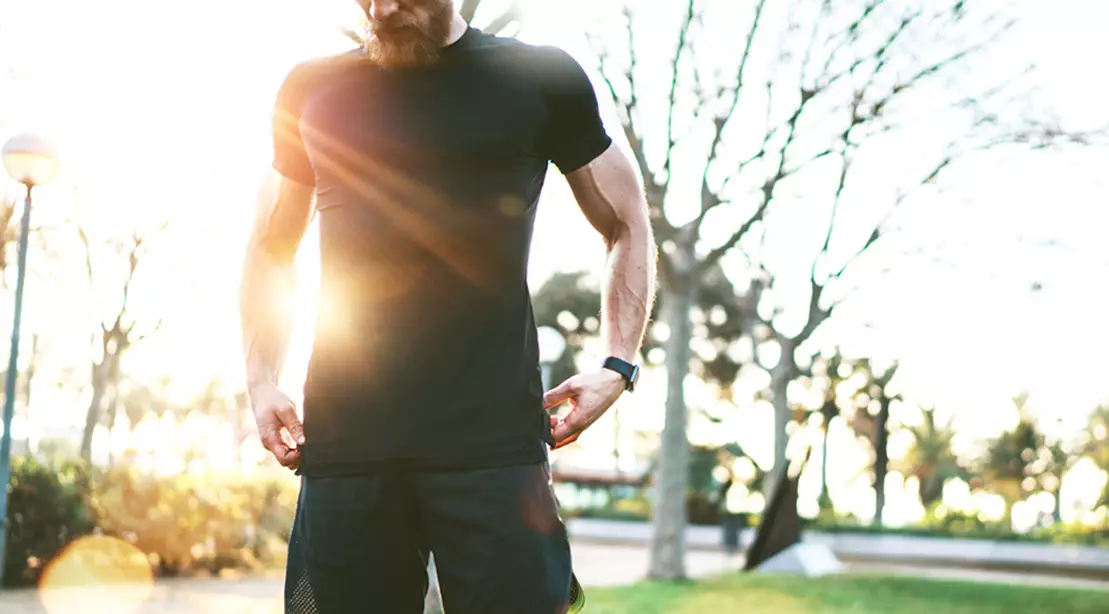 Muscular-Man-Standing-In-Front-of-Sunrise